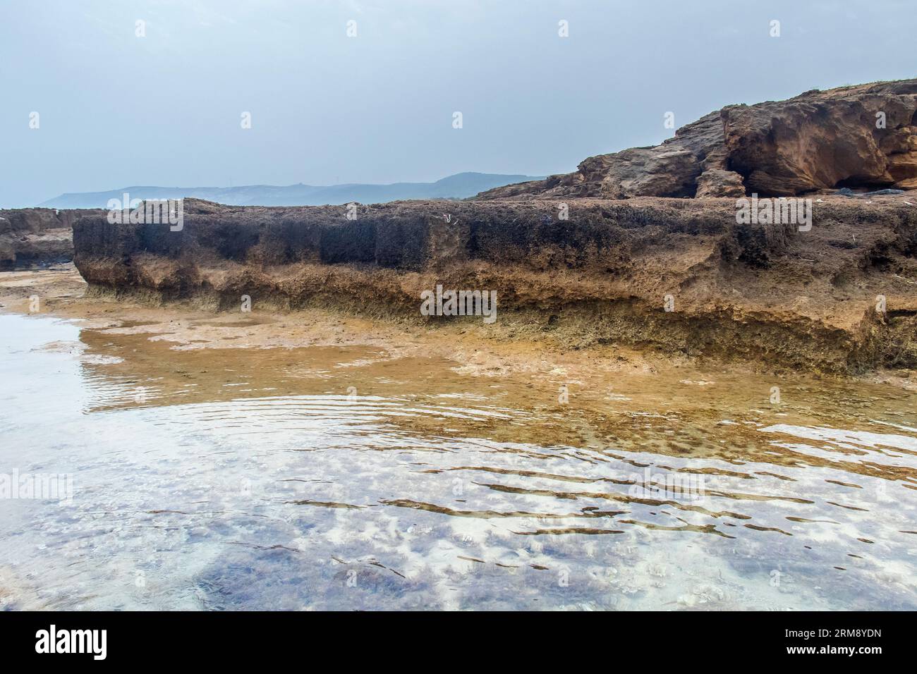 Harmony of Land and Sea: Rimel's Mountainous Landscape Meets Tranquil ...