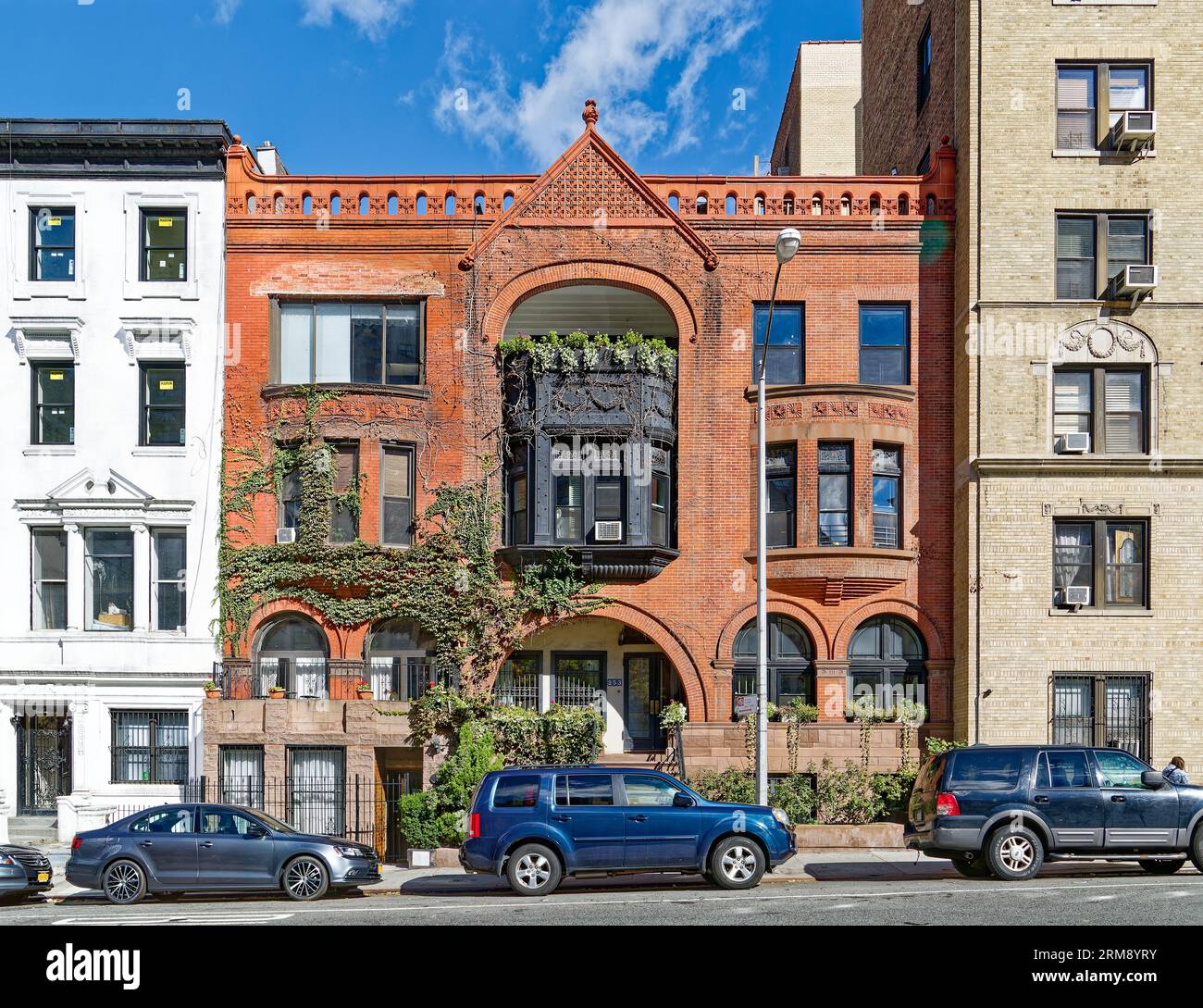 Upper West Side: Arches and oriels, in Queen Anne-styled brick, stone ...