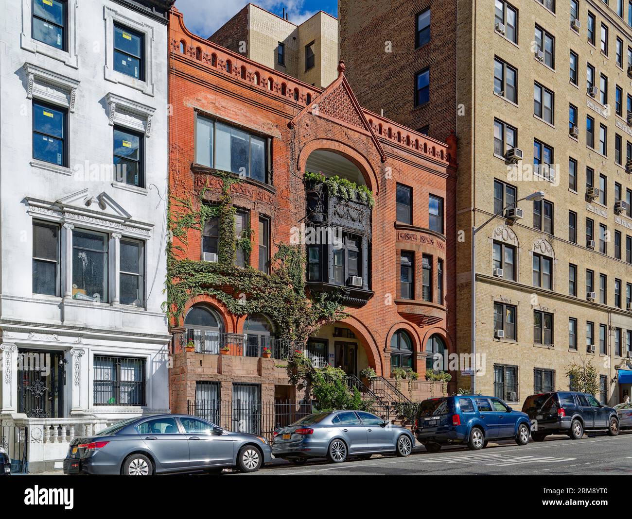Upper West Side: Arches and oriels, in Queen Anne-styled brick, stone ...