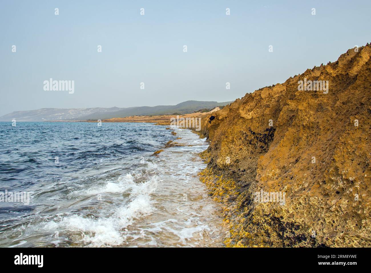 Harmony of Land and Sea: Rimel's Mountainous Landscape Meets Tranquil ...