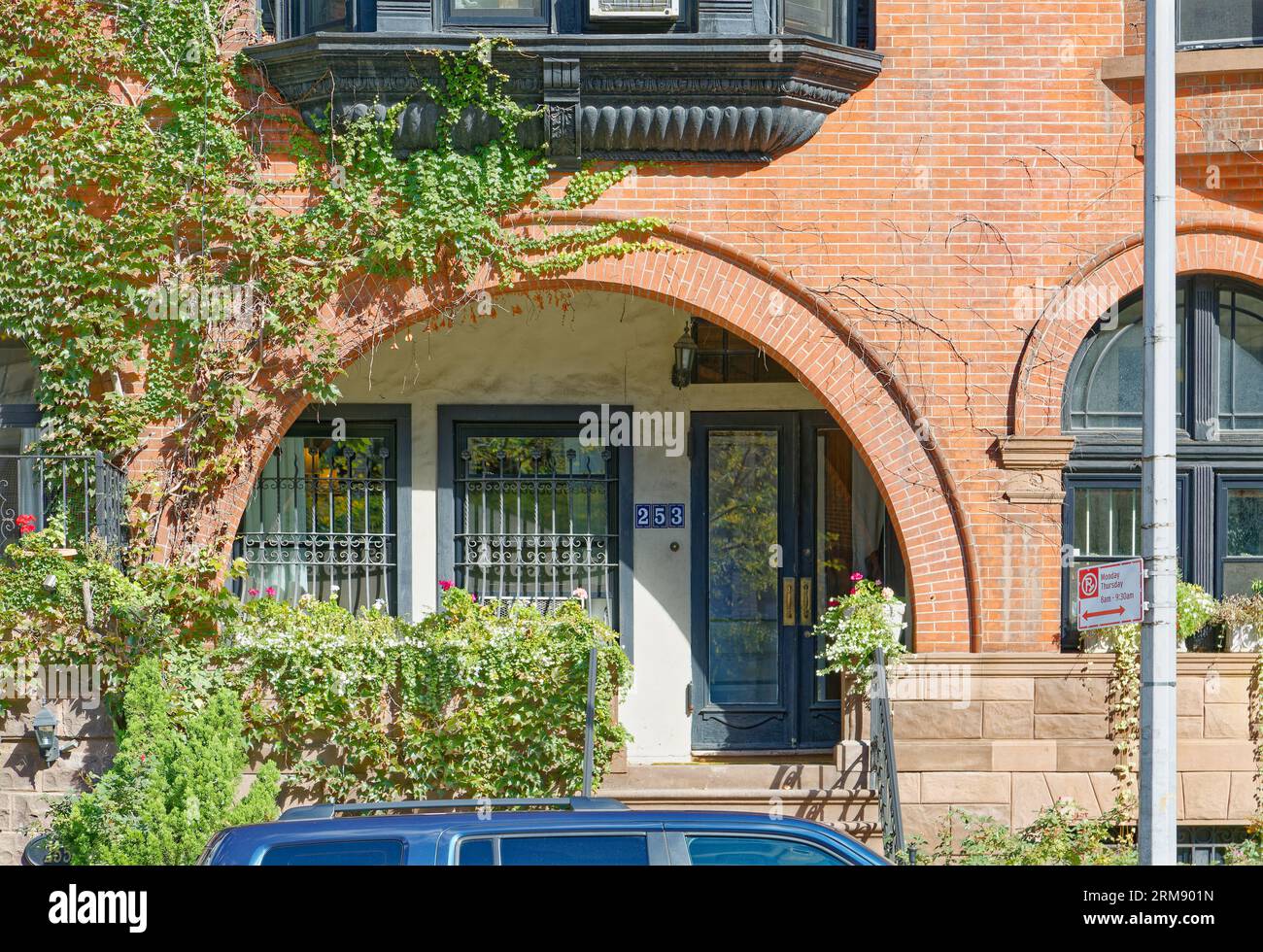 Upper West Side: Arches and oriels, in Queen Anne-styled brick, stone ...