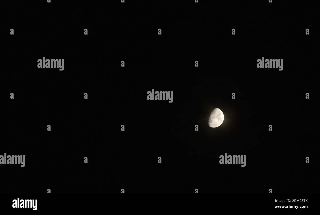 half moon cover by spreading cloud in night Stock Photo - Alamy