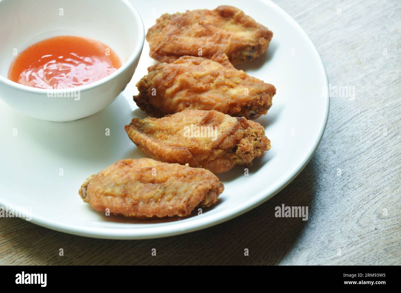 crispy fried chicken wing dipping chili sauce arranging on plate Stock ...