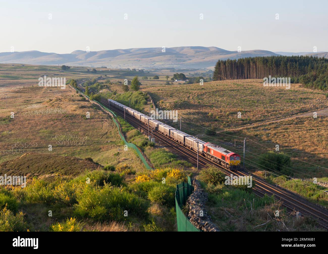 DB cargo Class 66 locomotive on the west coast main line in Cumbria at ...