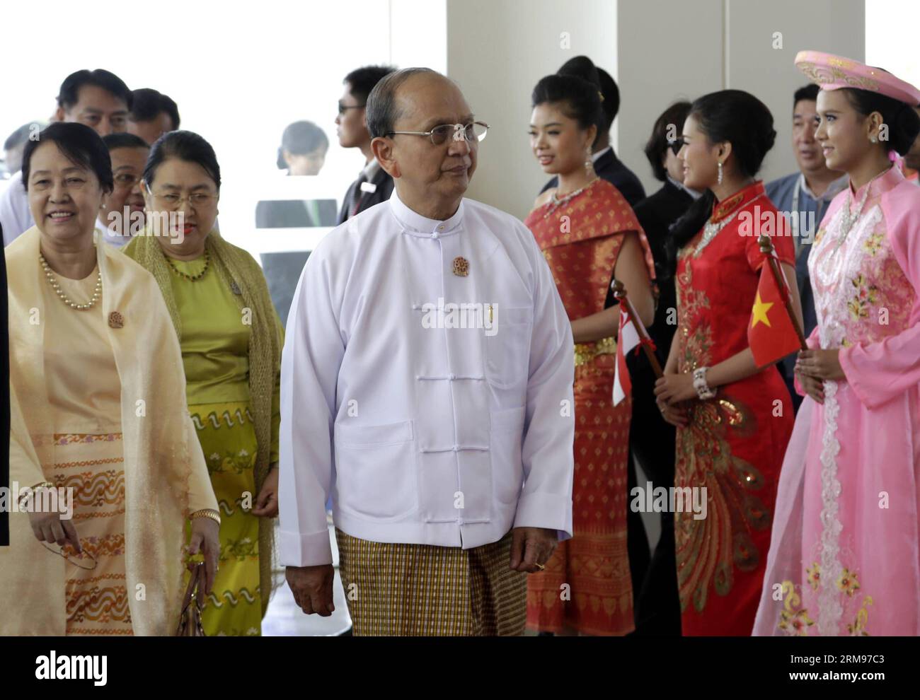 Myanmar s President U Thein Sein (C) arrives to attend the opening ...