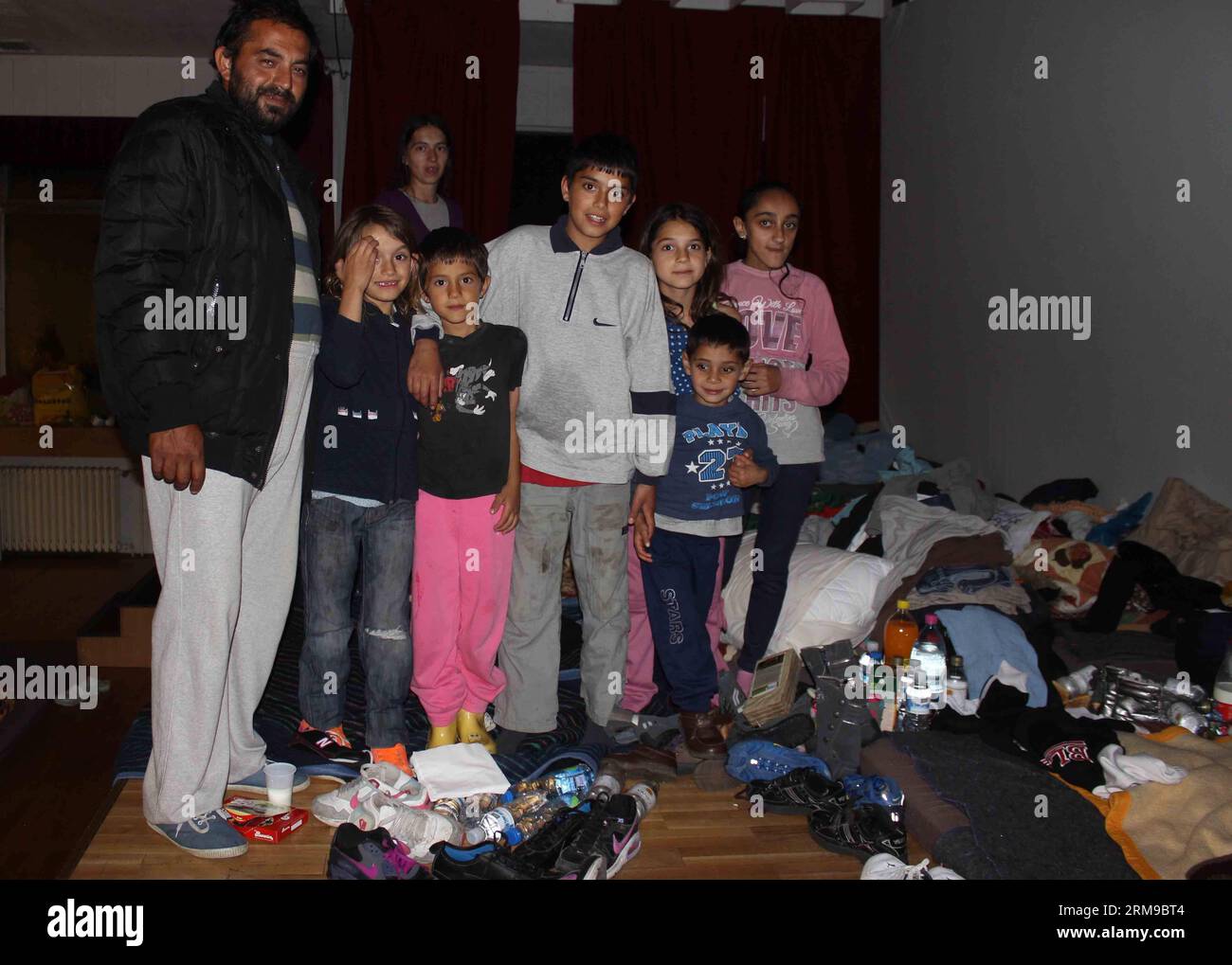 Sasa Mitrovic, Slavica Djukic and their six children who are evacuated ...