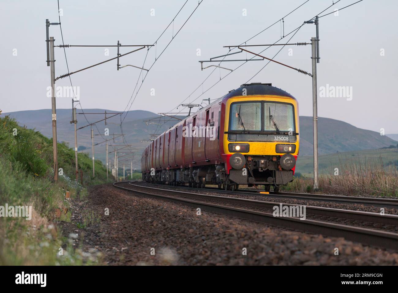 2 Royal mail class 325 trains climbing Shap bank Cumbria on the west ...