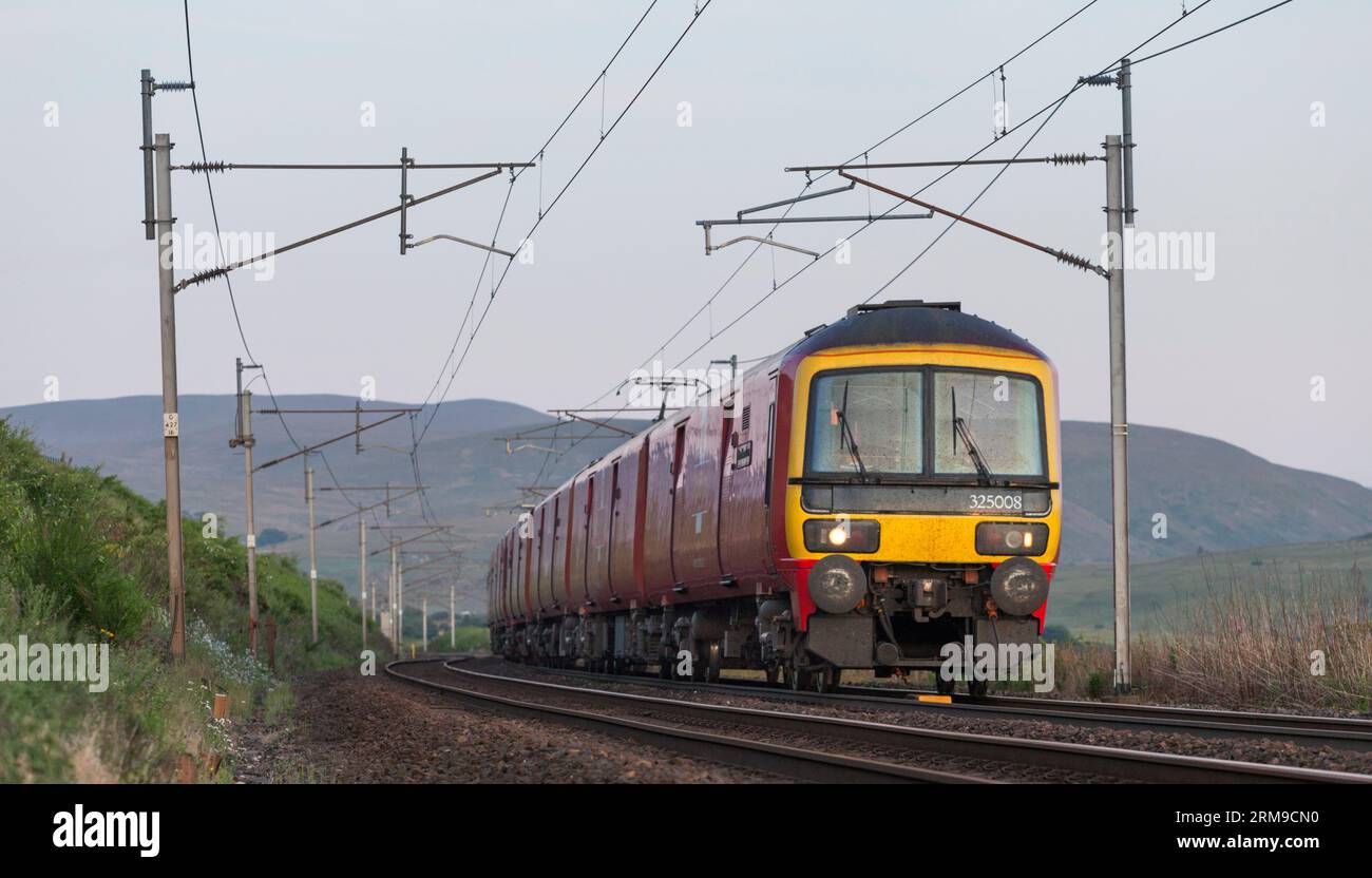 2 Royal mail class 325 trains climbing Shap bank Cumbria on the west ...