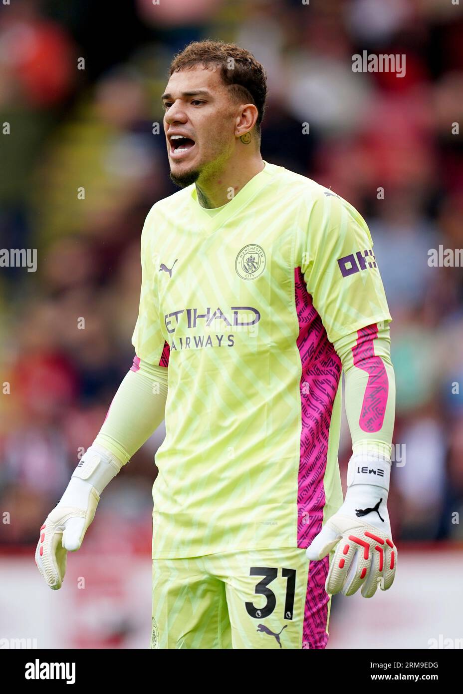 Manchester City's Ederson Moraes shouts instructions during the Premier ...