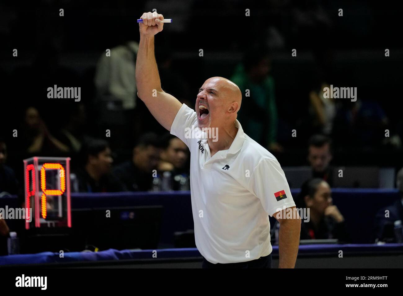 Angola coach Jose Claros Canals celebrate after their win against the ...