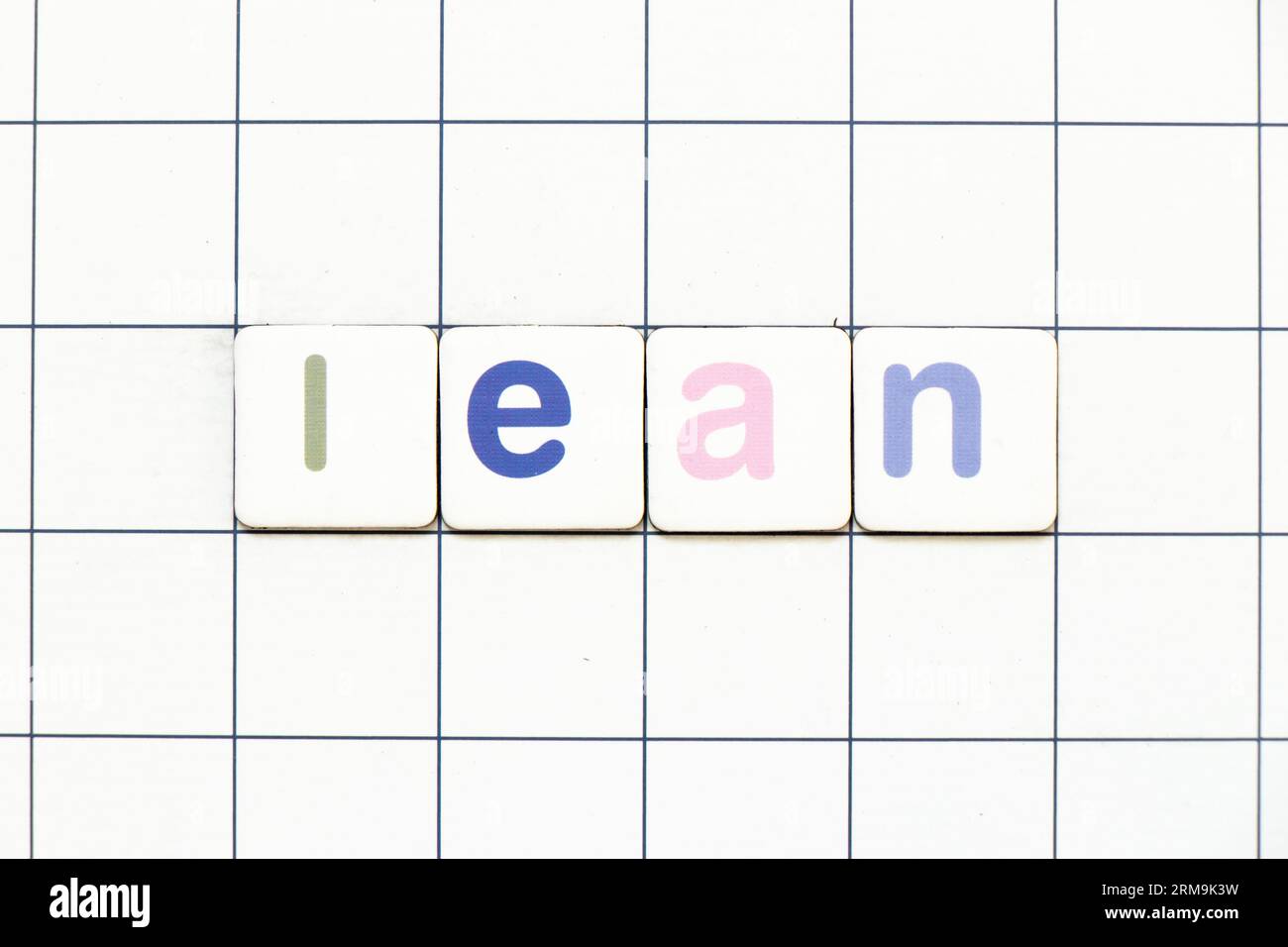Colorful tile letter in word lean on white grid background Stock Photo ...