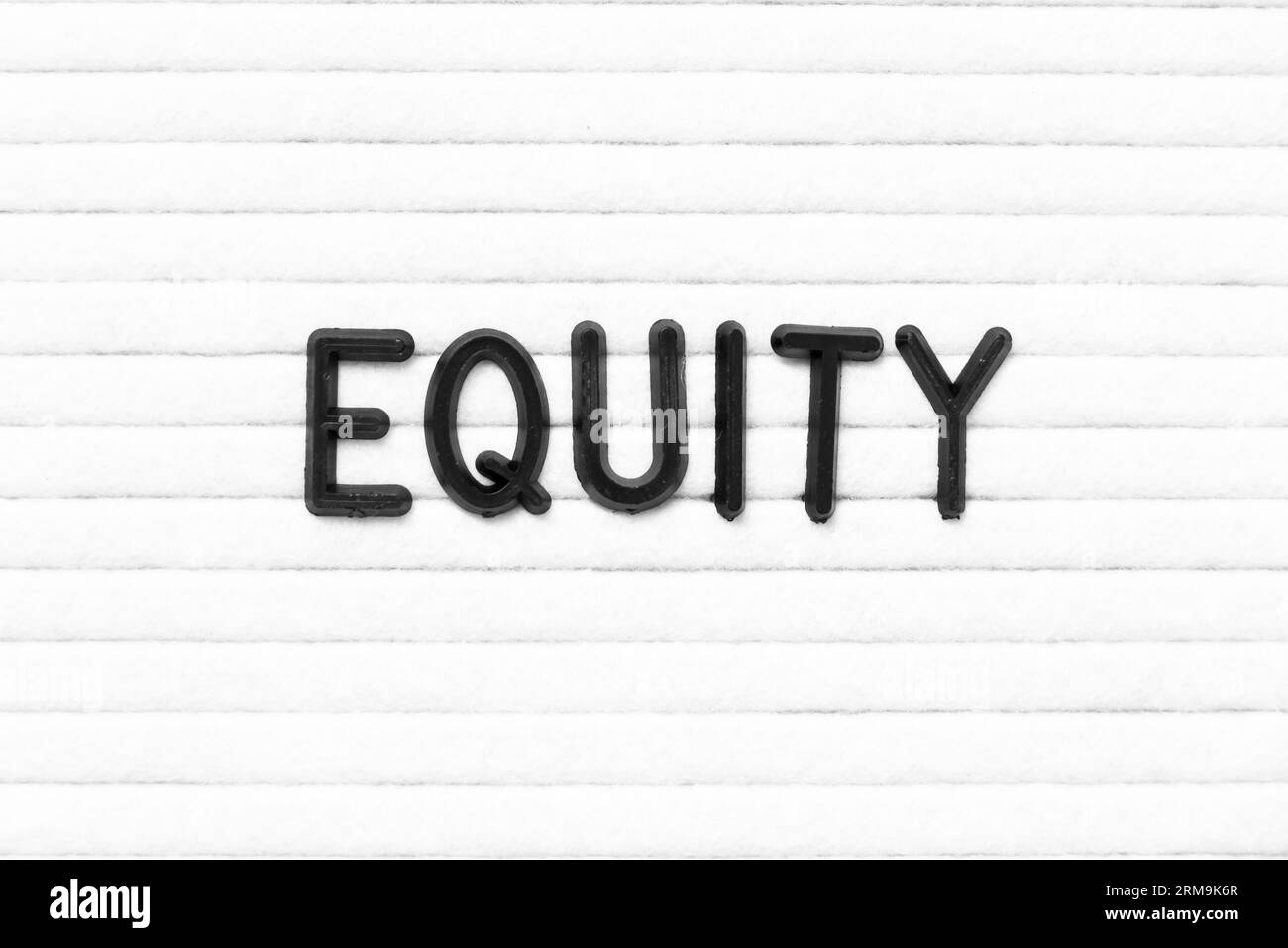 Black color letter in word equity on white felt board background Stock ...