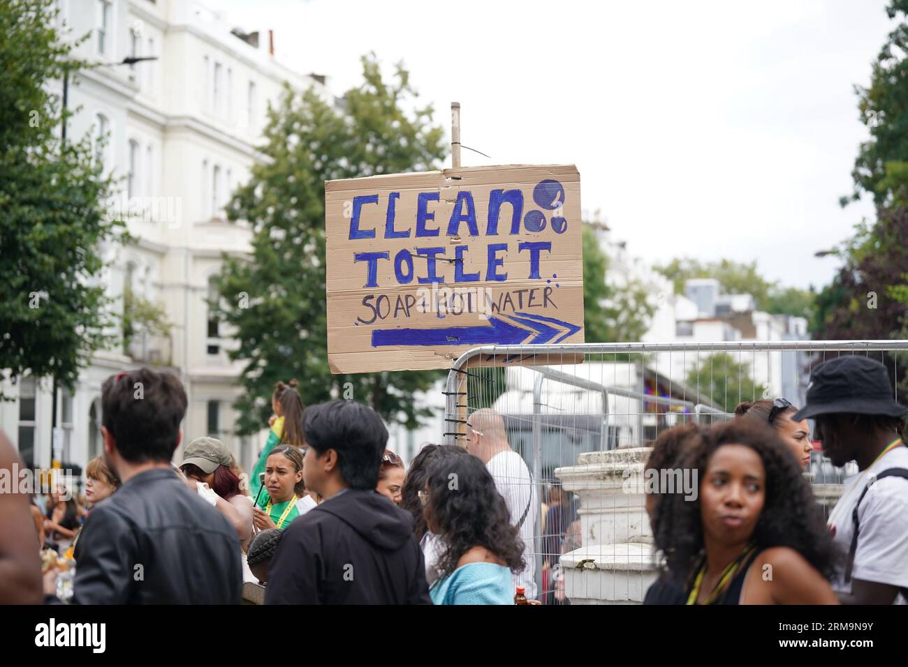 A sign directing people to a toilet facility during the Children's Day ...