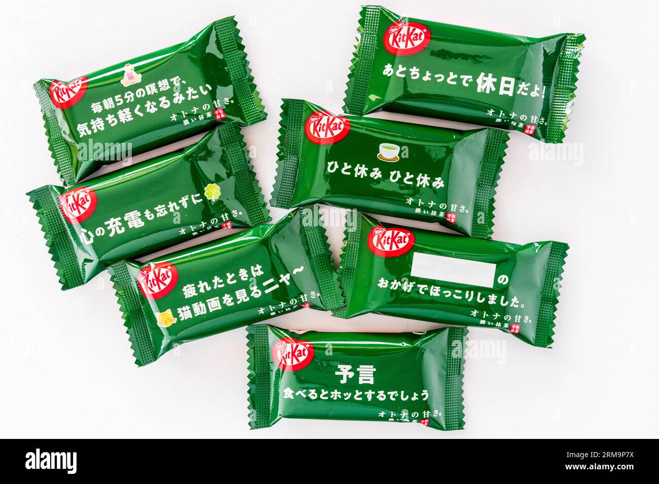 Several green tea favoured Japanese mini two finger kitkat packets on a ...