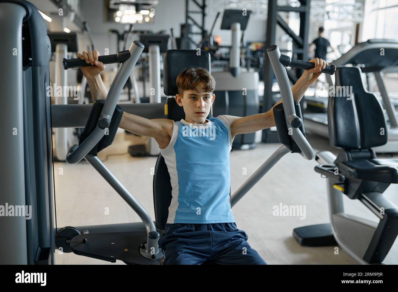 Active teenager boy doing physical exercise for masculinity development Stock Photo - Alamy
