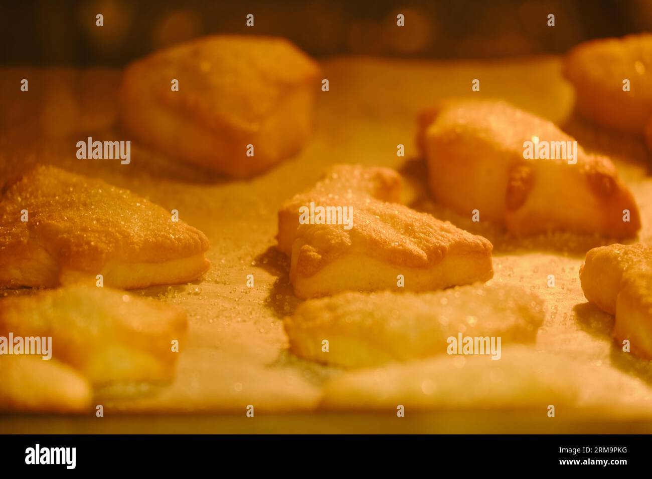 Process of baking cookies from puff pastry in the oven. Cooking cookies ...