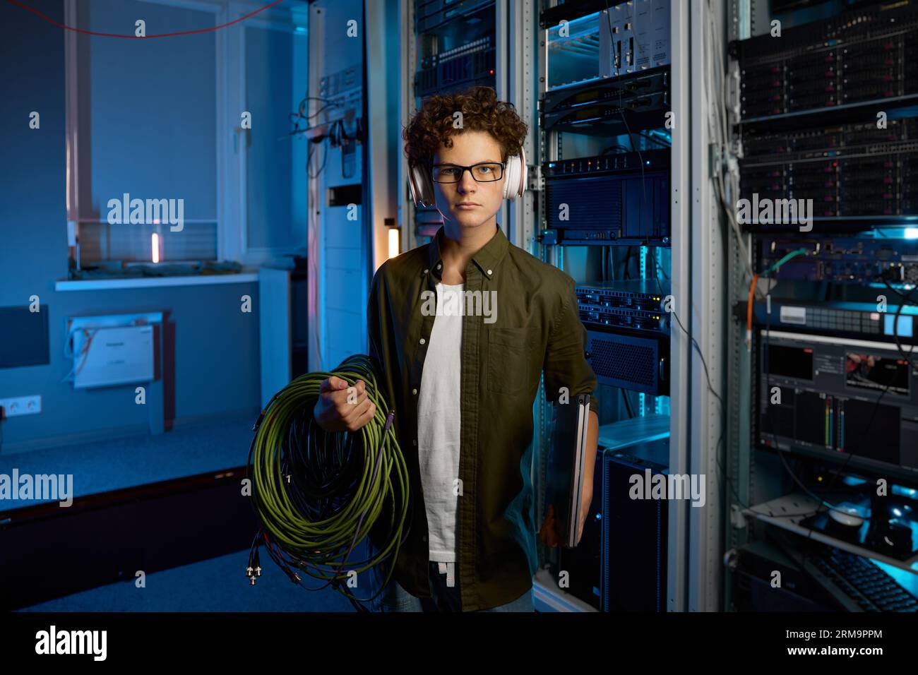 Smart teenager student having internship in modern data center Stock ...