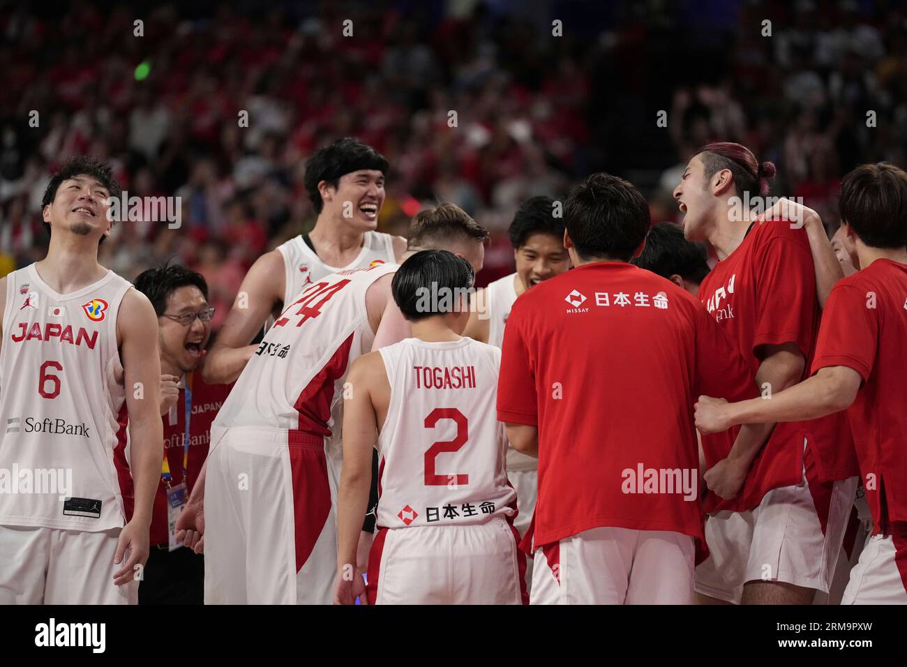 Japan team members celebrate after defeating Finland in the Basketball ...