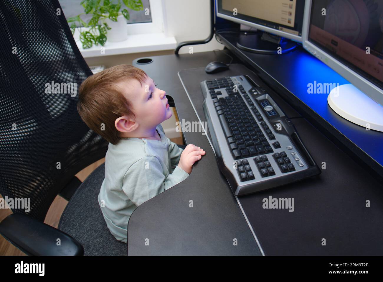 Using two monitors at home office hi-res stock photography and images ...