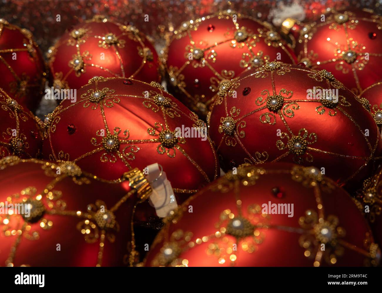 Christmas bright red eggs with gold decorations lying on the counter of ...