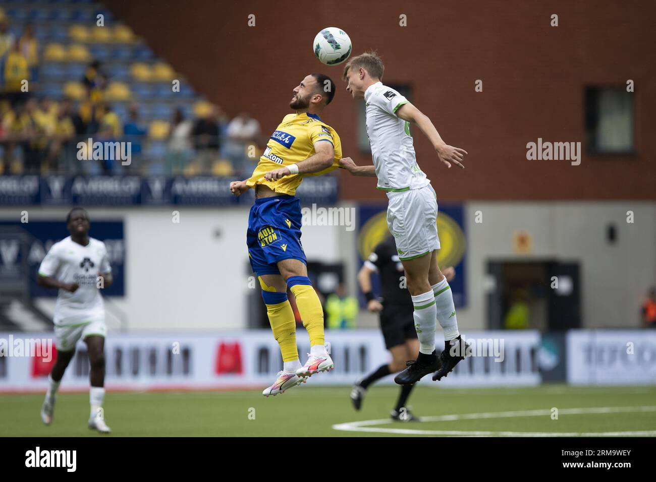 Sint Truiden, Belgium. 27th Aug, 2023. STVV's Fatih Kaya and Cercle's Chris Christiaan Ravych ...