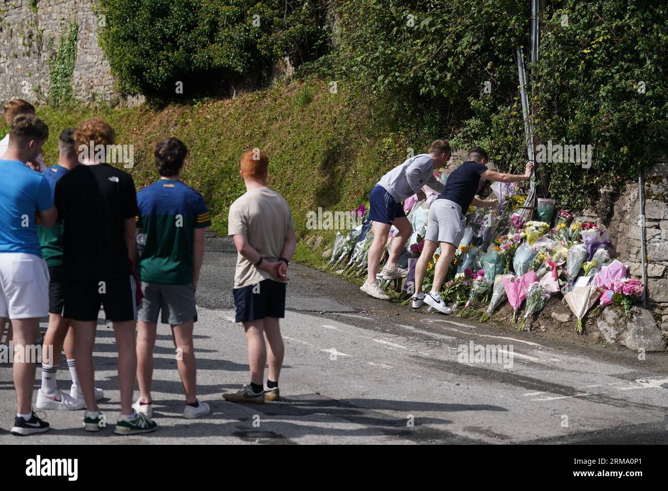 Flowers and tributes left at the scene in Clonmel, Co Tipperary where ...