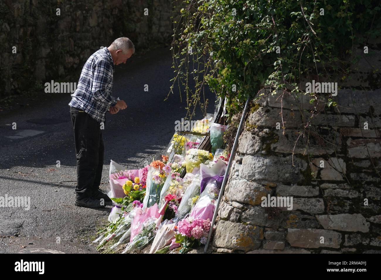 Flowers and tributes left at the scene in Clonmel, Co Tipperary where ...