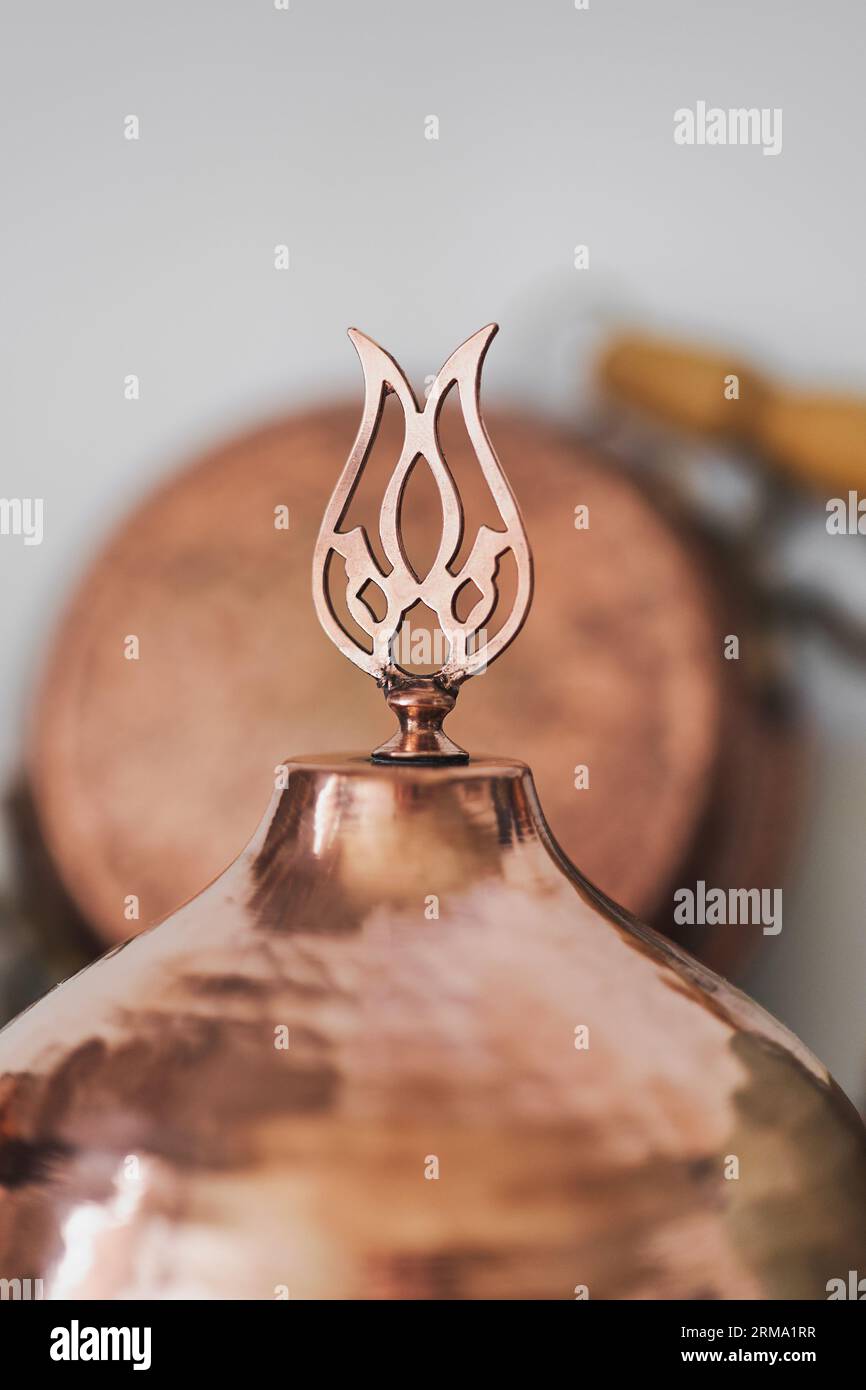 Details of lids with dishes on traditional copper Turkish utensils on a ...