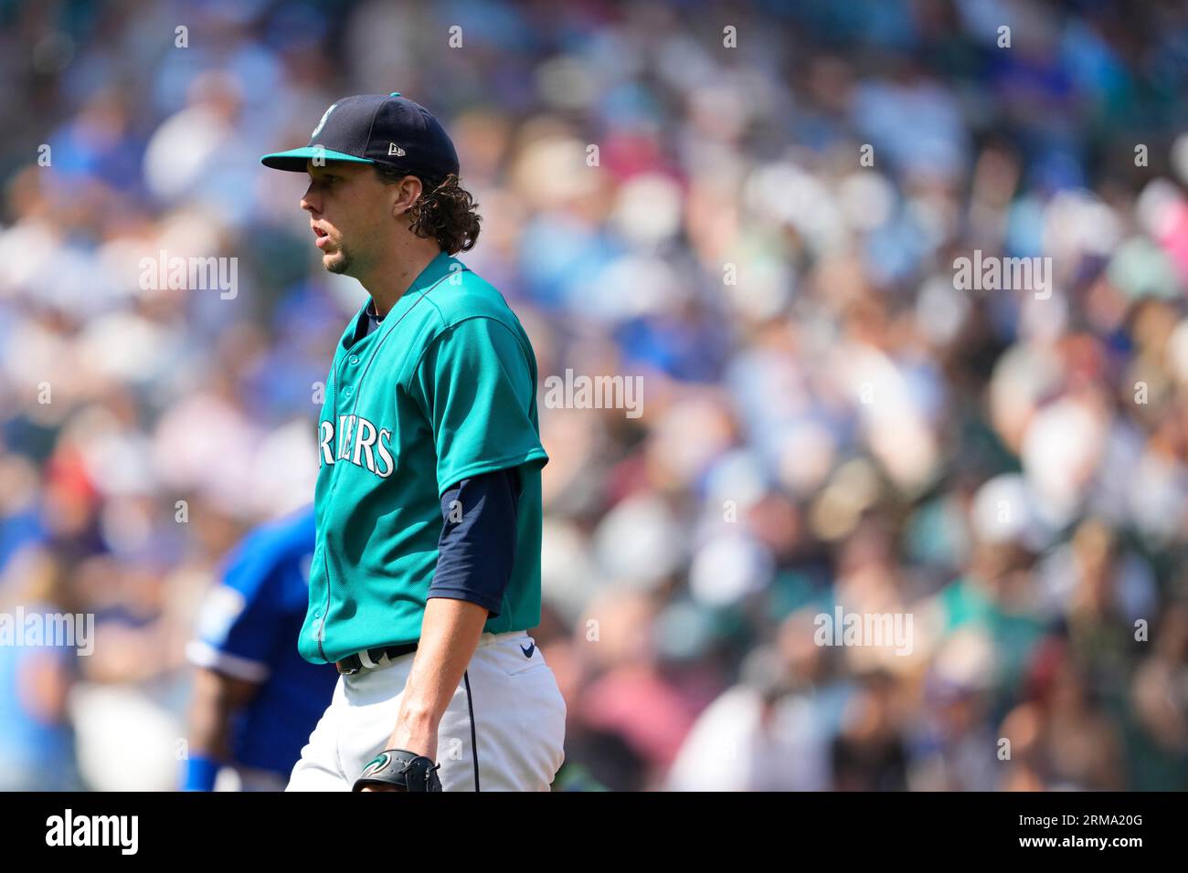 Seattle Mariners starting pitcher Logan Gilbert walks off the field in ...