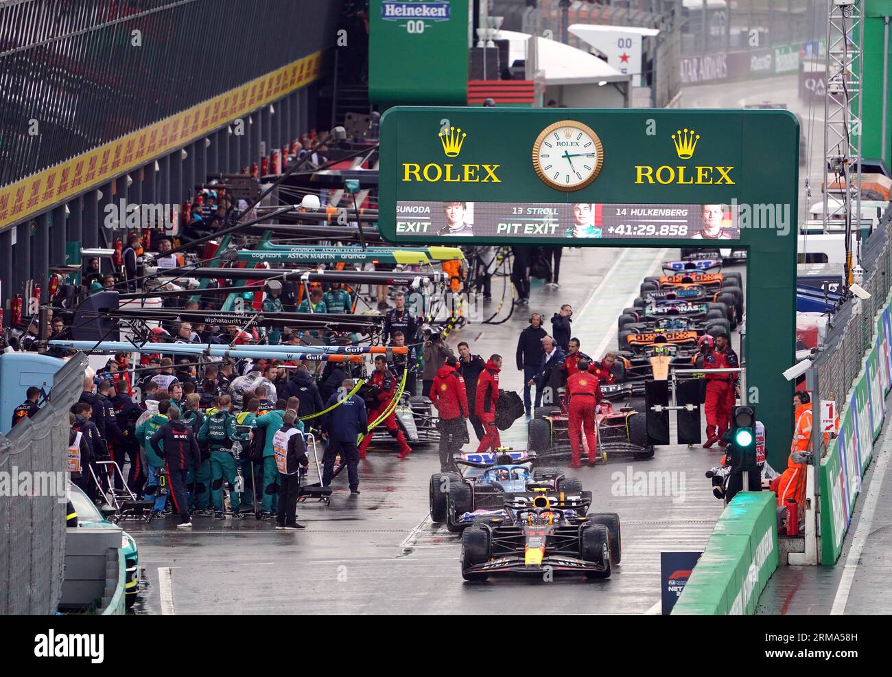 The cars leave the pits for the restart of the race during the ...