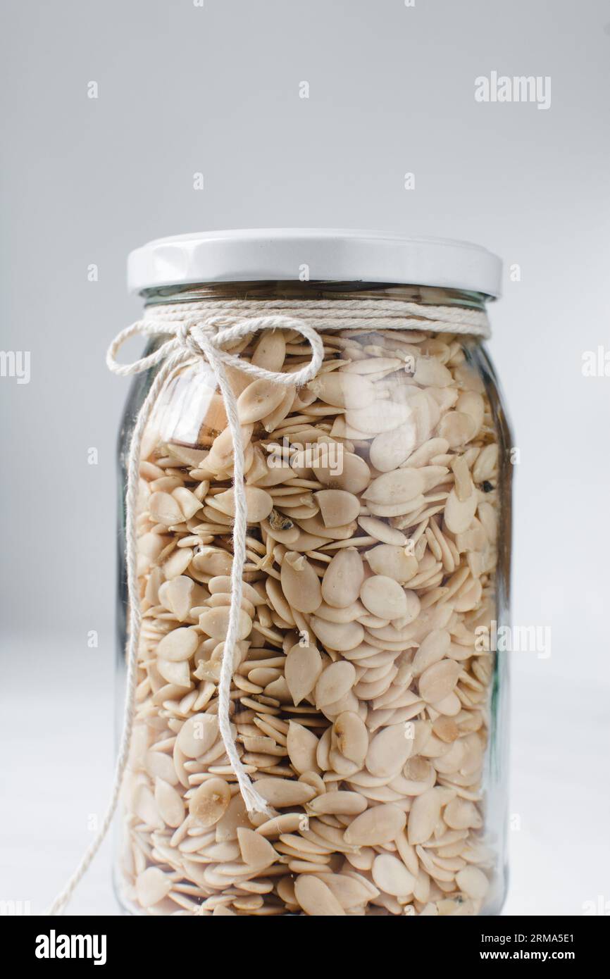 nigerian egusi seeds in a glass jar, shelled melon seeds in a ...