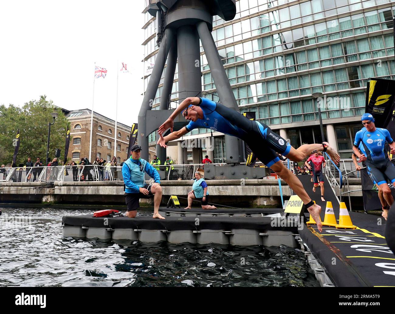 Max Stapley jumps into the water as he competes in the Men's Race ...