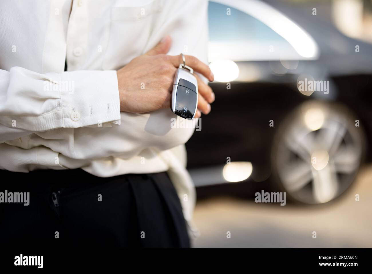 Woman hand holds black car hi-res stock photography and images - Alamy
