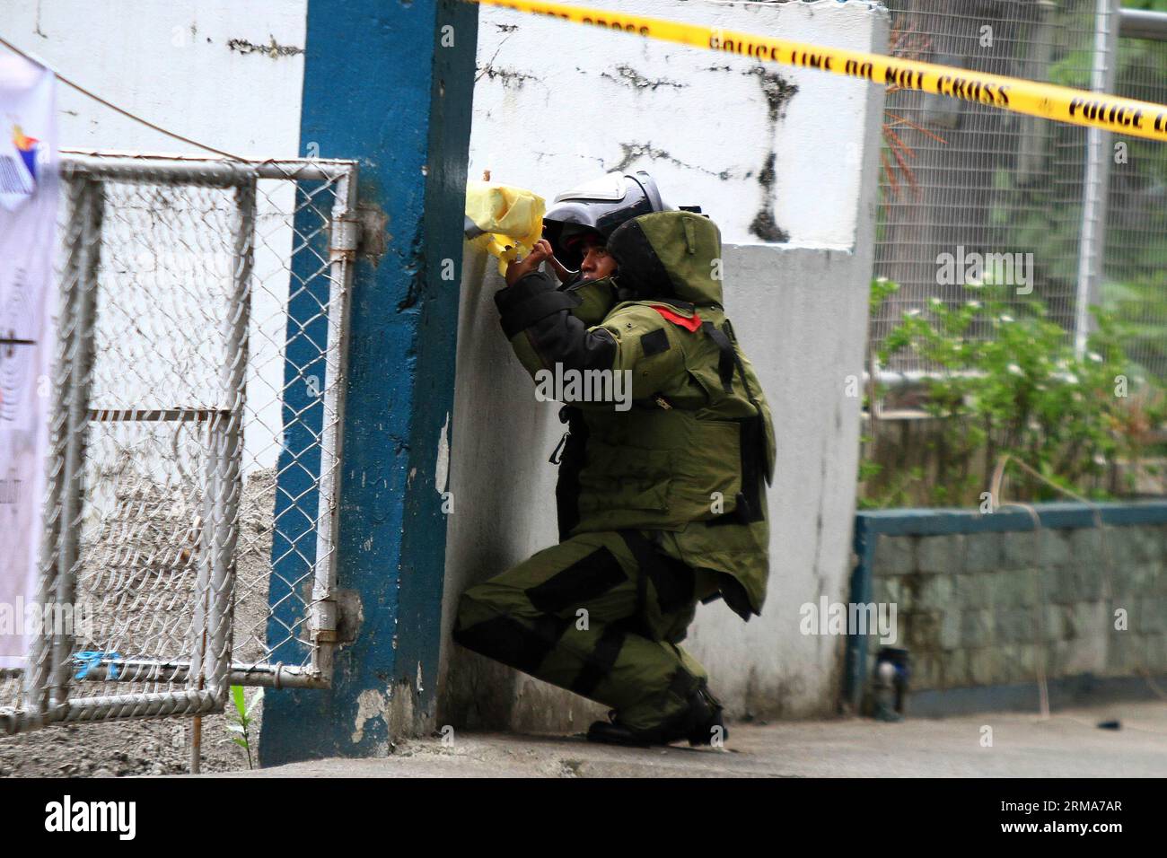 A personnel from the Bomb Squad of the Philippine National Police (PNP ...
