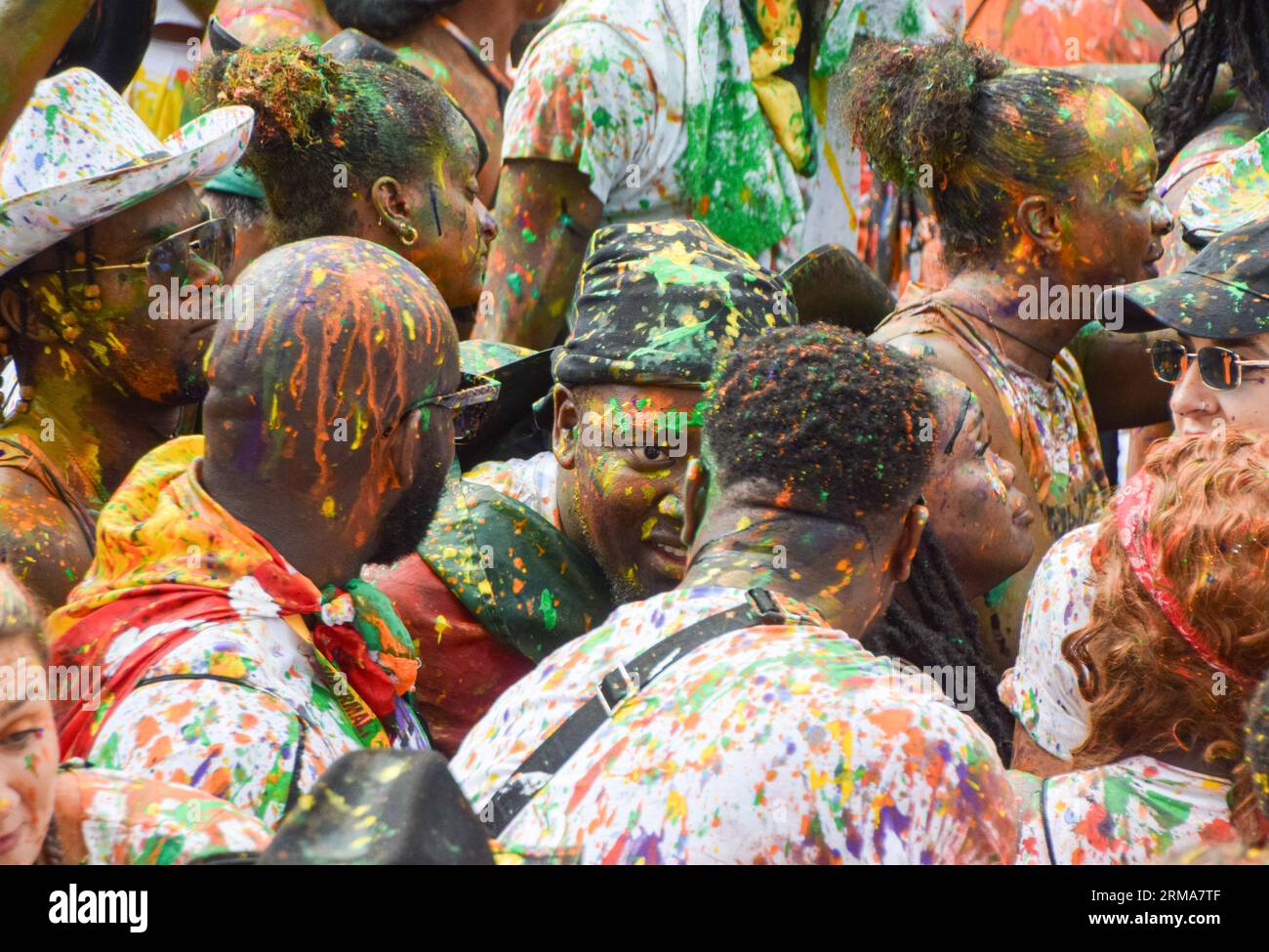 London, England, UK. 27th Aug, 2023. Parade participants spray paint ...