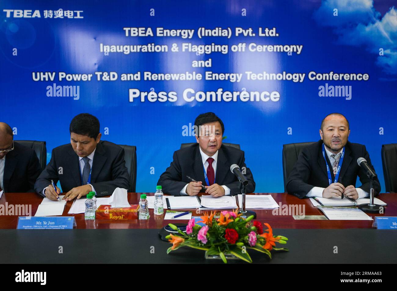 Zhang Xin (2nd R), Chairman of Tebian Electric Apparatus (TBEA), gives ...