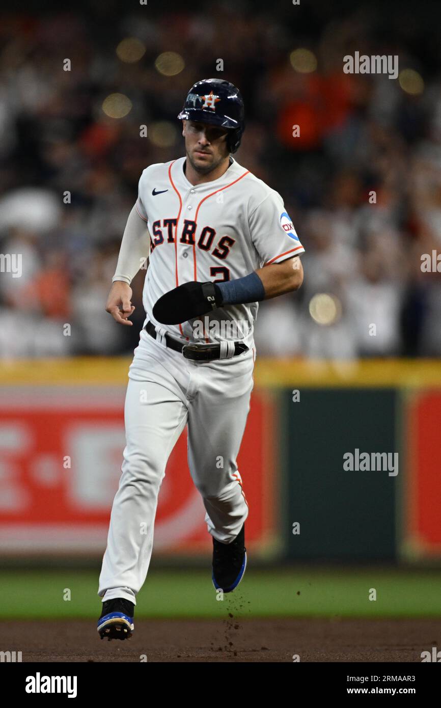 Houston Astros third baseman Alex Bregman (2) rounds second base and scores on a home run by ...
