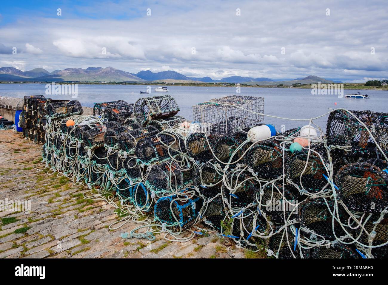 Fishing nets and traps on the jetty of a small fishing port Stock Photo ...