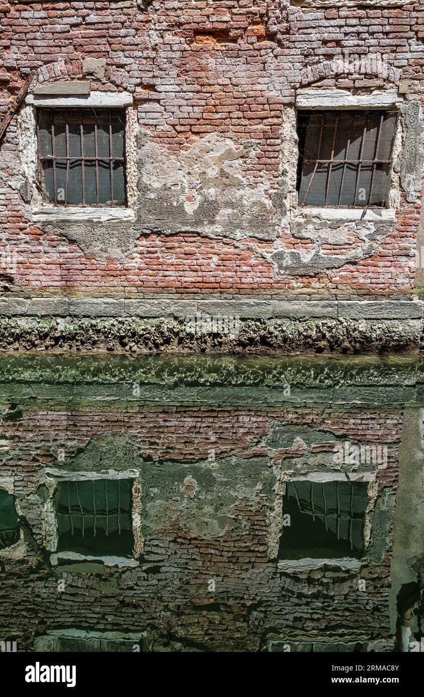 Old medieval worn out brick wall building in Venice, Italy Stock Photo ...
