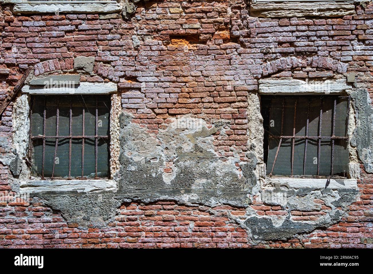 Old medieval worn out brick wall building in Venice, Italy Stock Photo ...