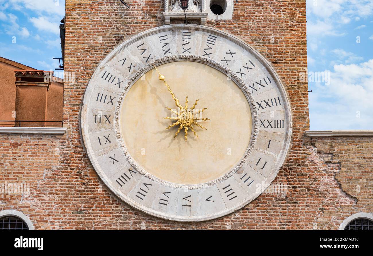 The iconic medieval old clock on the facade of Chiesa di San Giacomo di ...