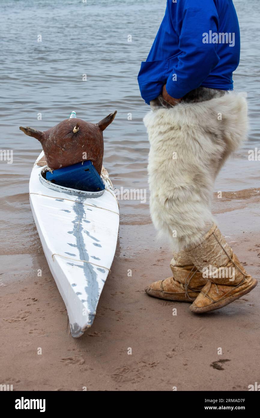 Northwestern Greenland, Baffin Bay. Village man in traditional attire ...
