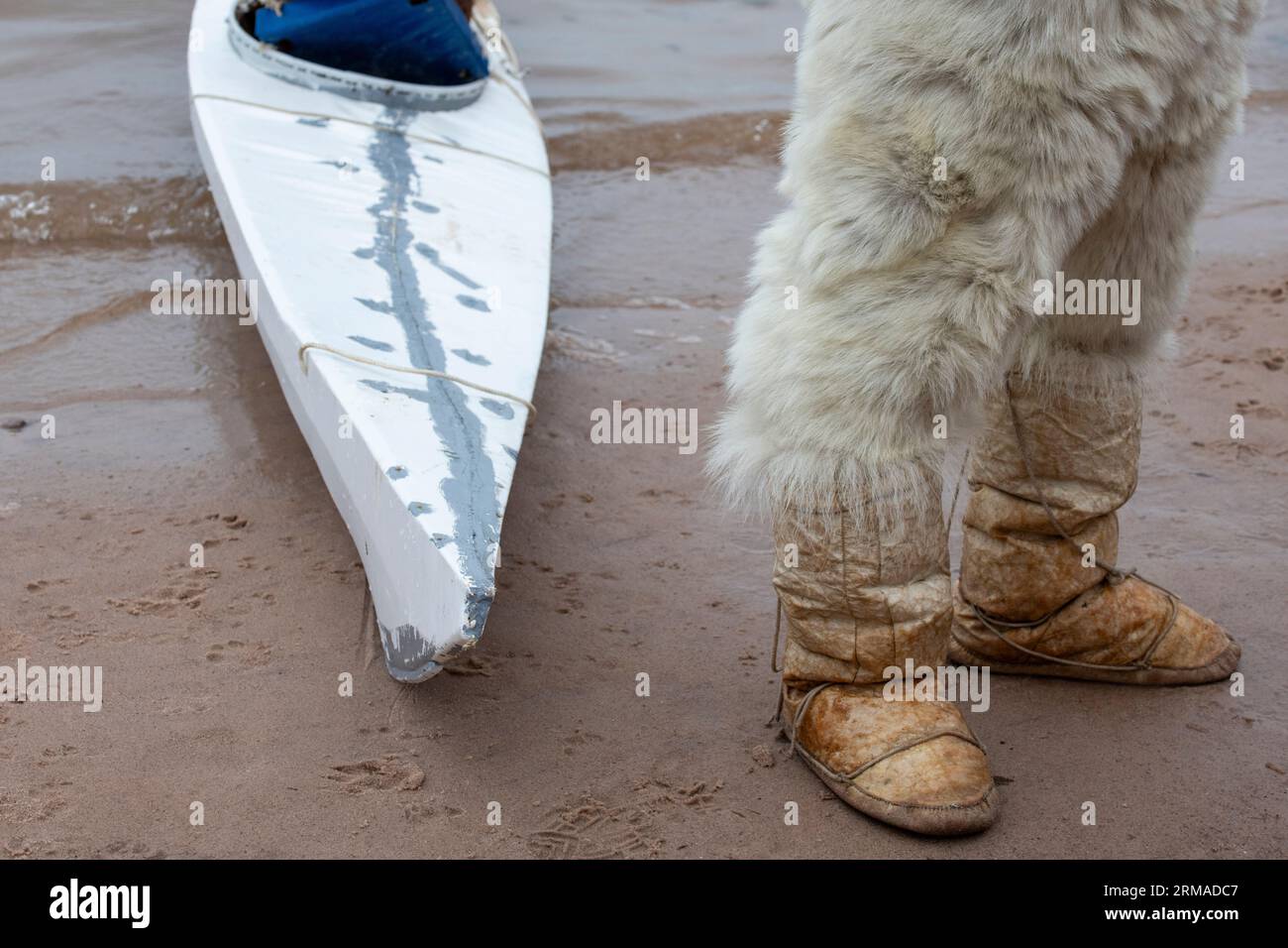 Northwestern Greenland, Baffin Bay. Village man in traditional attire ...