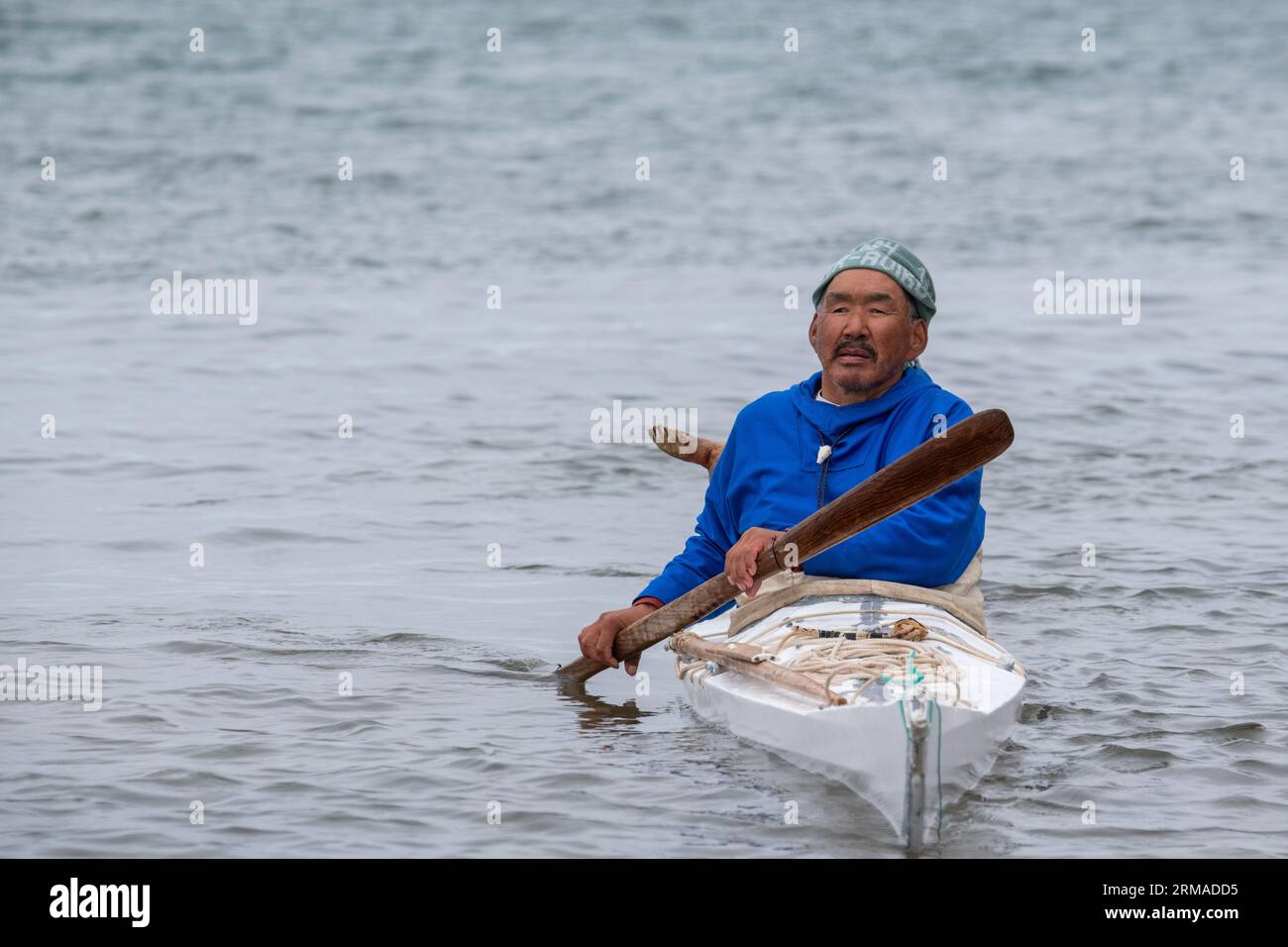 Northwestern Greenland. Man in traditional kayak Stock Photo - Alamy