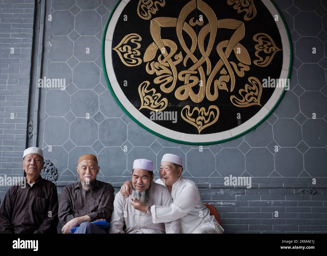 YINCHUAN, July 3, 2014 (Xinhua) -- Muslims wait for praying at the ...