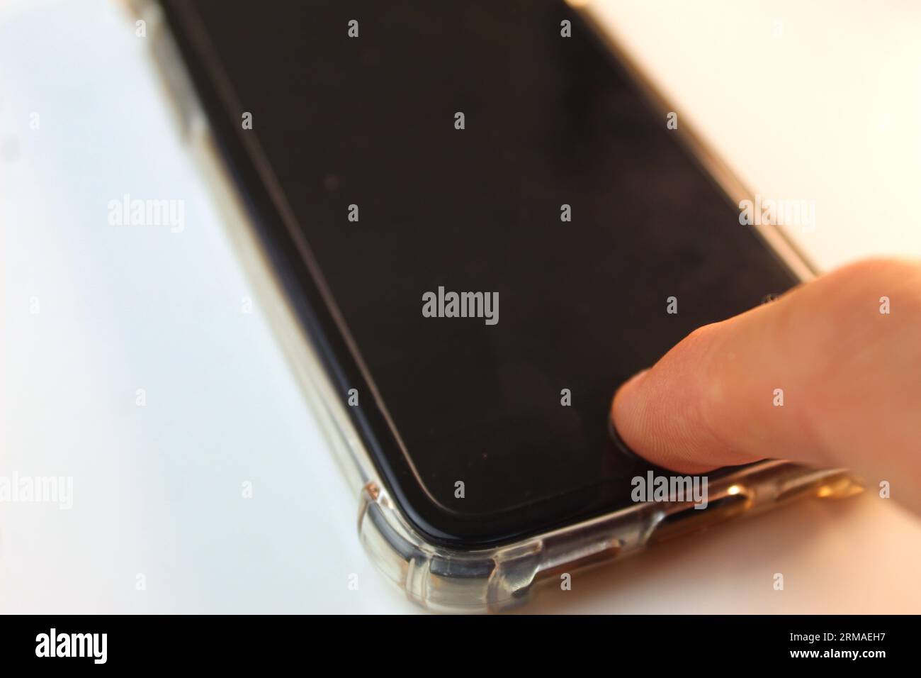 A photo of a person using their mobile phone Stock Photo - Alamy