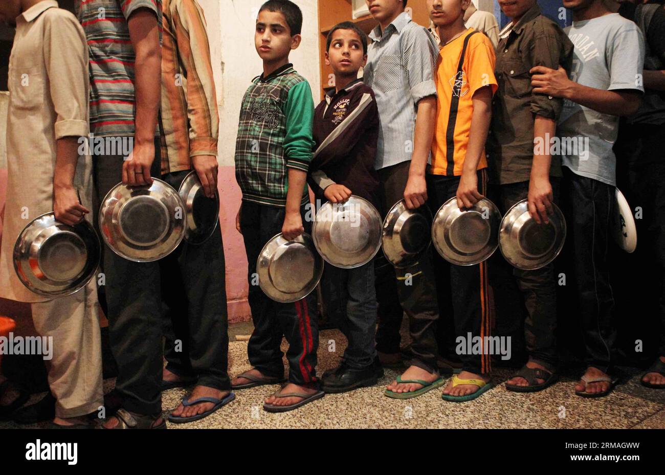 Kashmiri muslim orphans break ramadan hi-res stock photography and ...