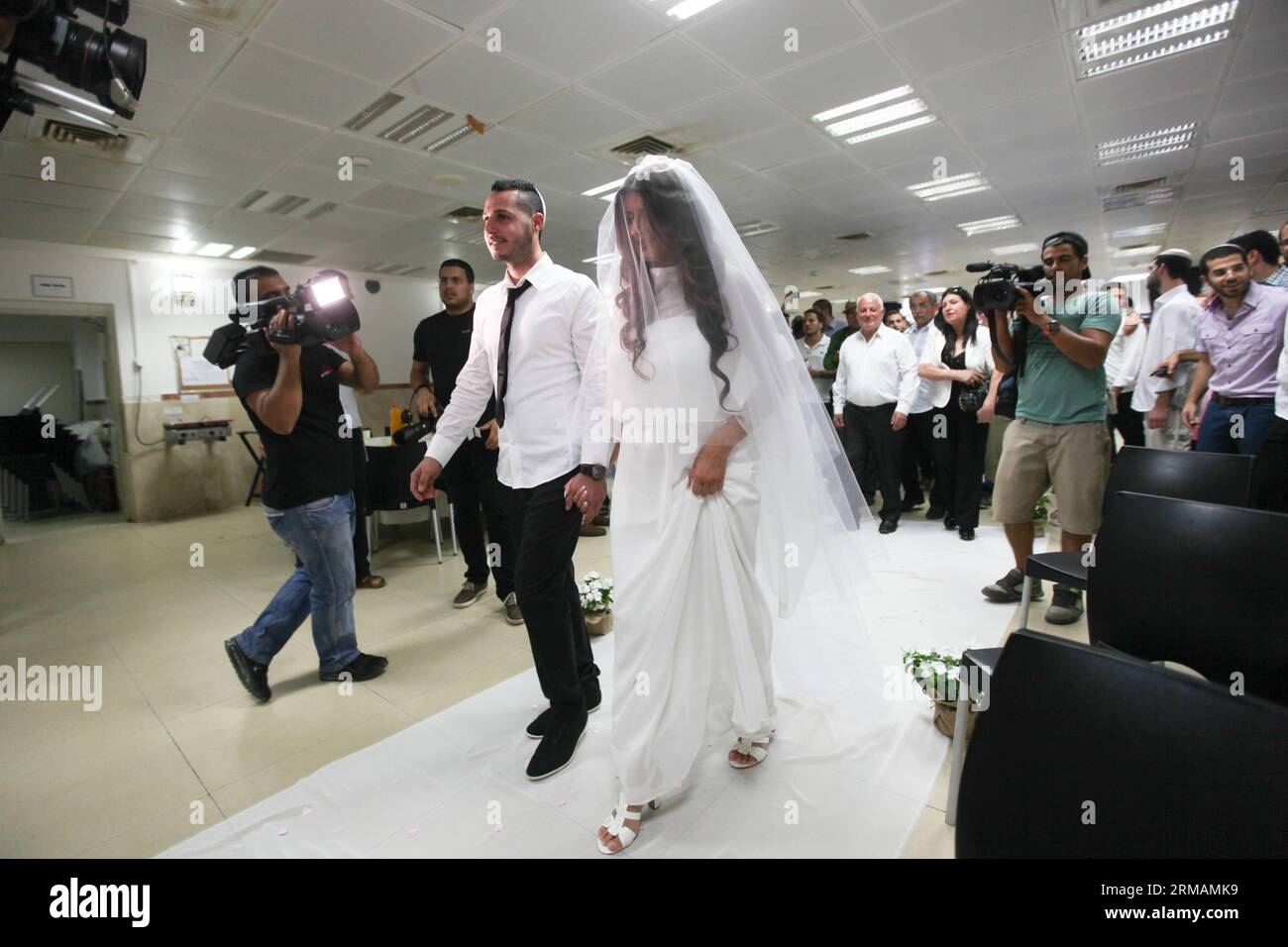 Israeli bride Zohar and her groom Haim are seen at their wedding party ...
