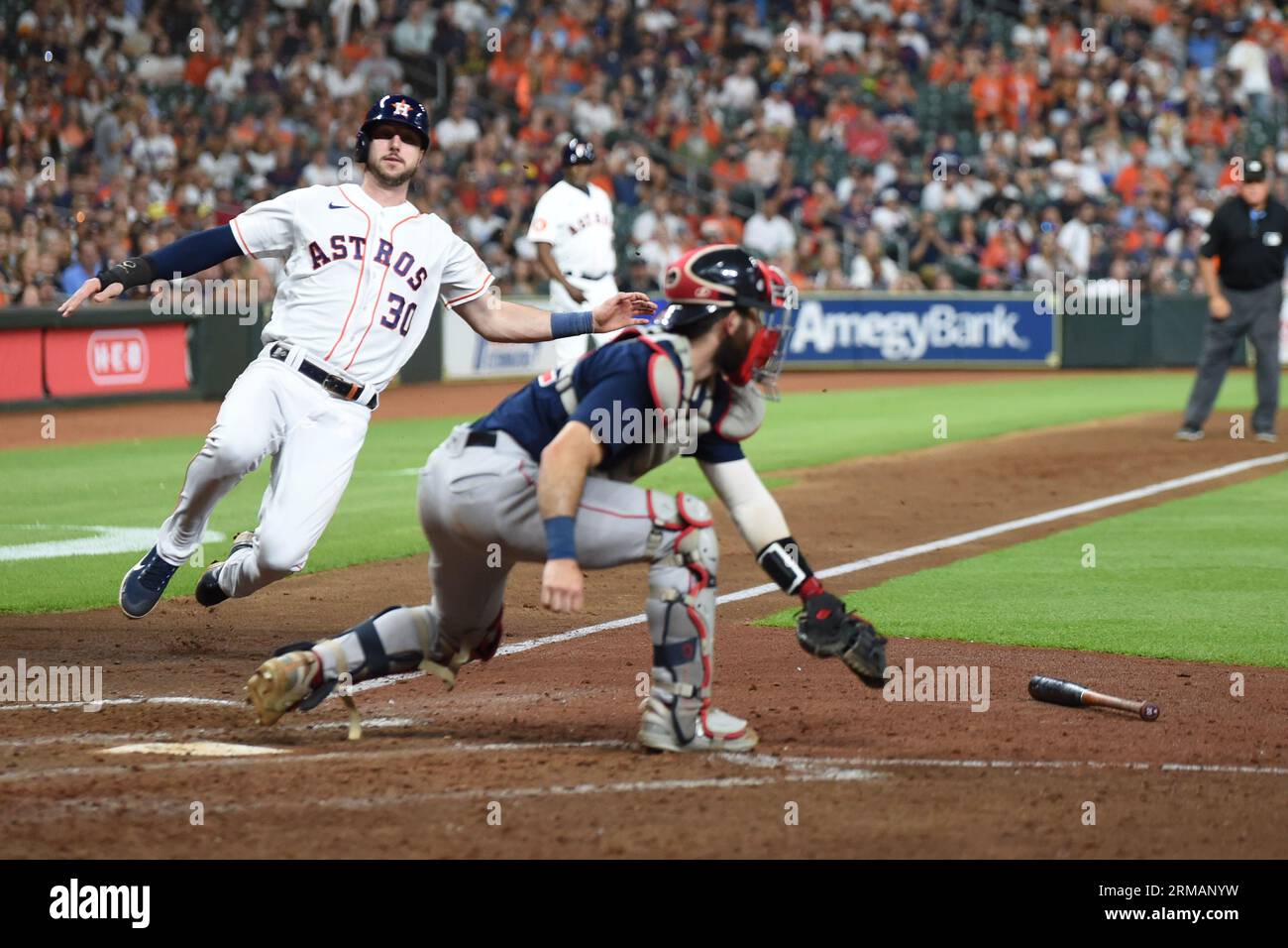Houston Astros right fielder Kyle Tucker (30) scores on a fielders-choice by Houston Astros ...