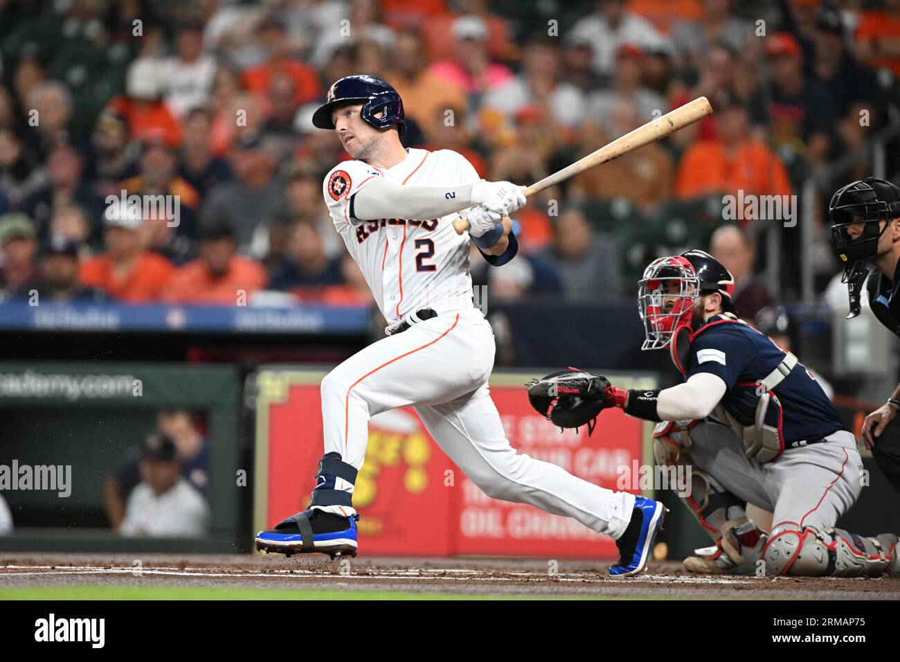 Houston Astros third baseman Alex Bregman (2) gets a hit in the first inning of the MLB game ...